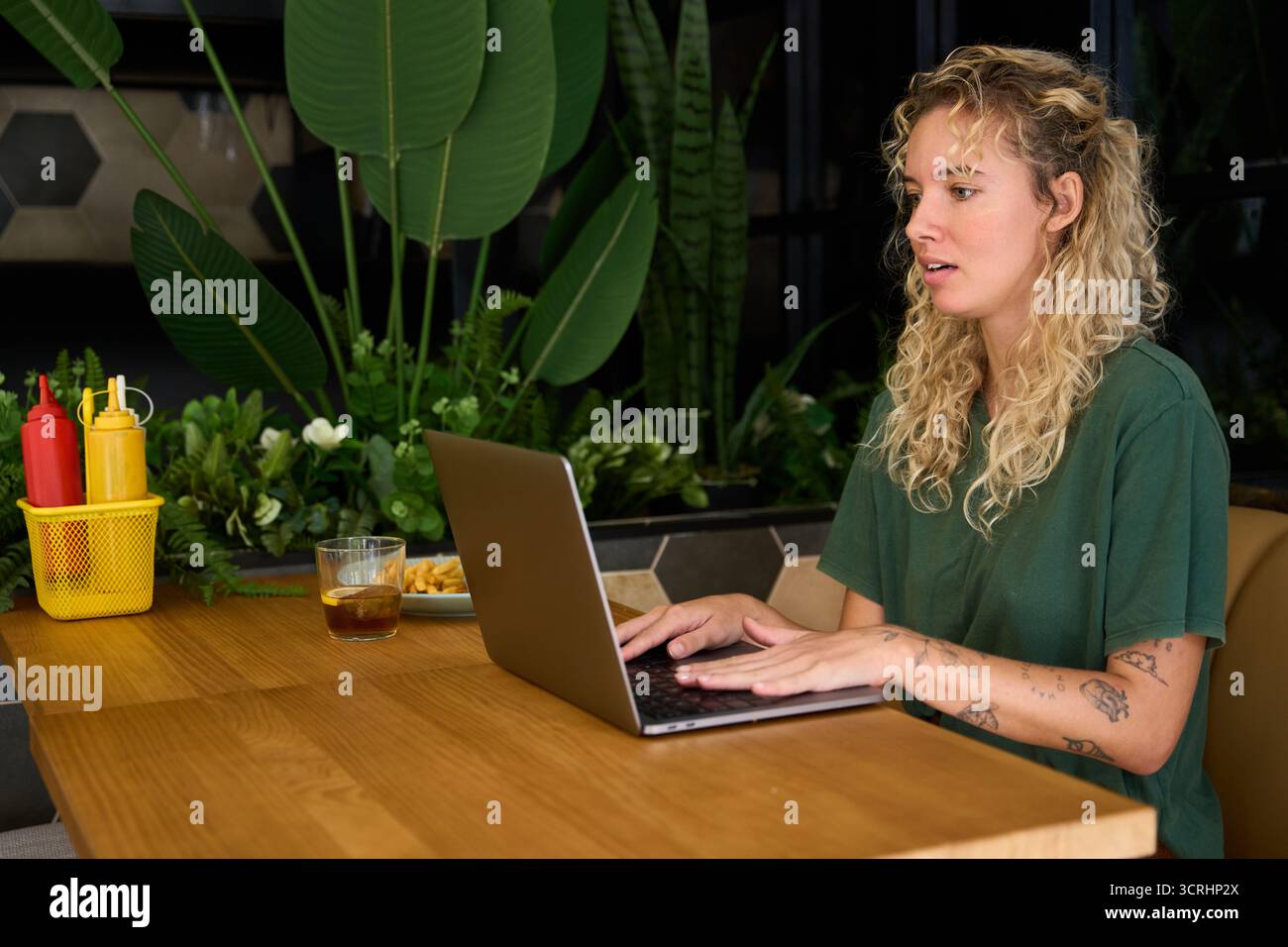 Woman working focused on laptop hi-res stock photography and images - Alamy