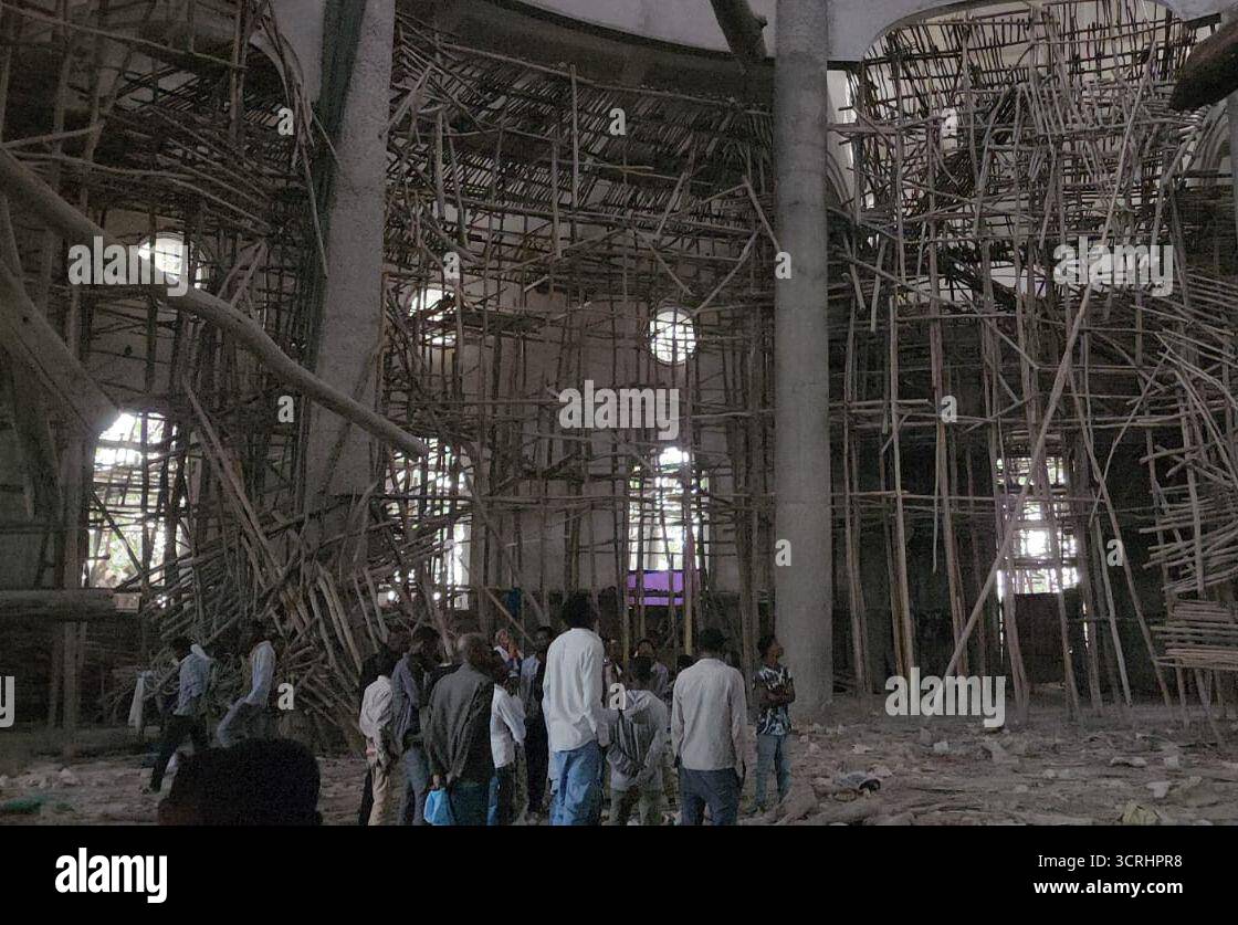 Worshippers stand inside the Menjar Shenkora Arerti Mariam Church under ...