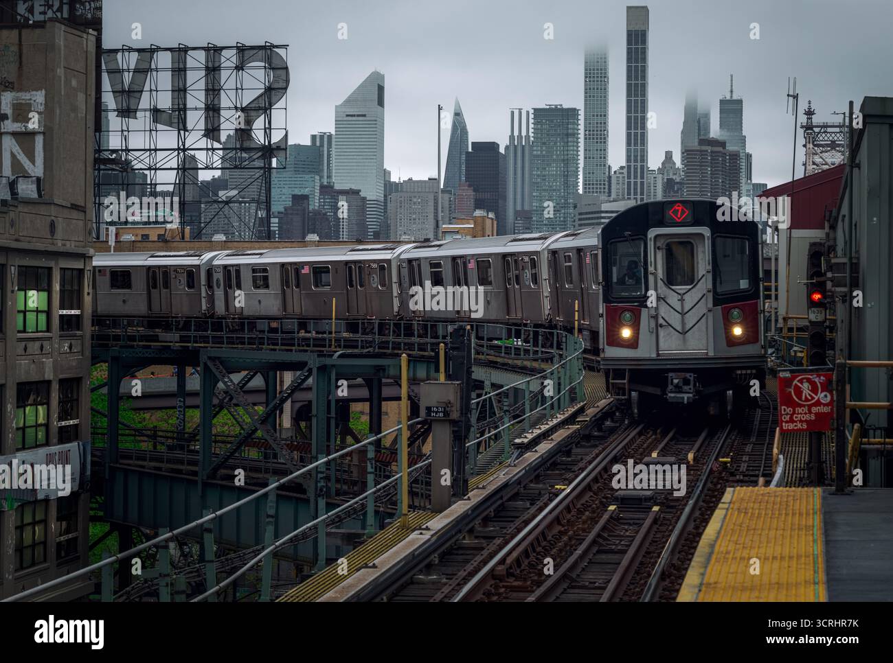 Urban Subway No. 7 Train New York Arriving on Elevated Tracks with City ...