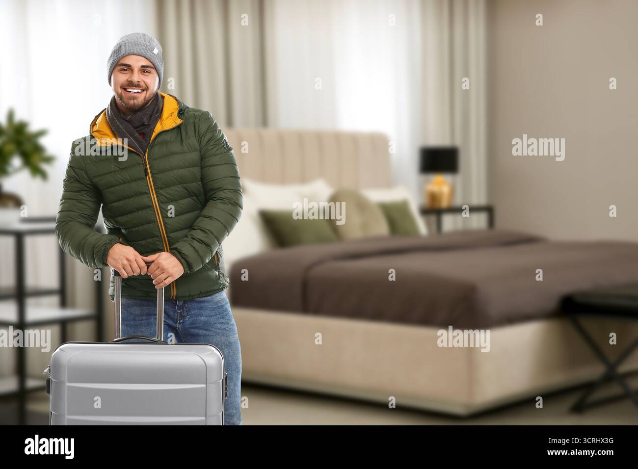 Suitcase in hotel room hi-res stock photography and images - Alamy