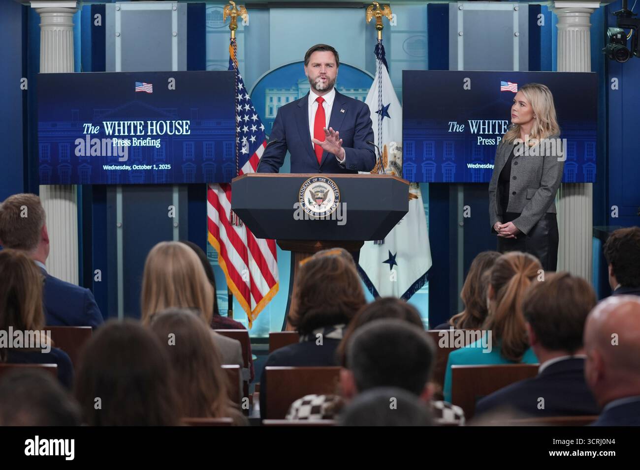 Vice President JD Vance, left, with White House press secretary ...
