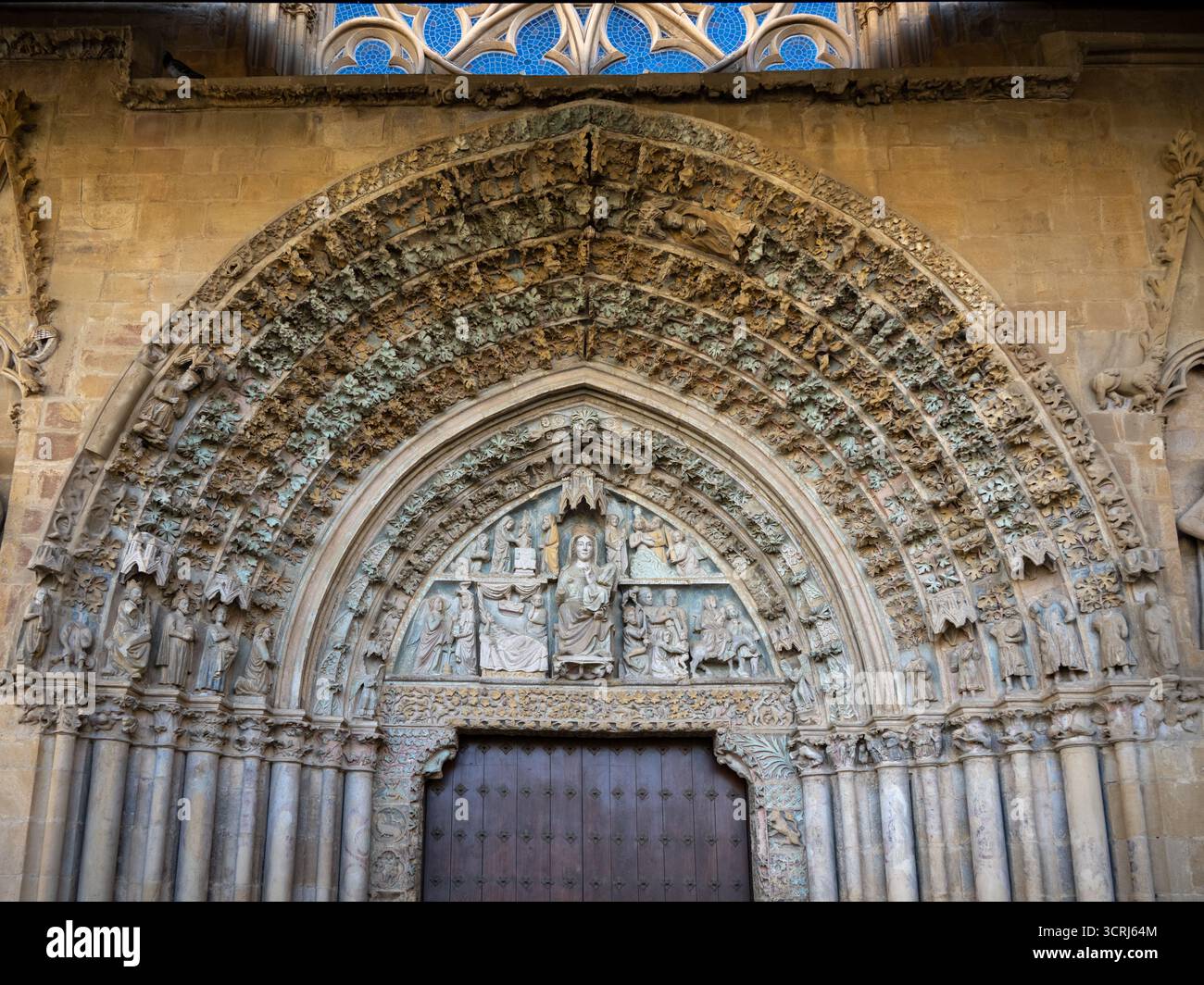 Ornate stone archway with intricate carvings and sculptures, featuring ...