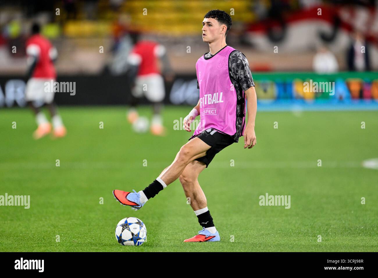 Manchester City's Phil Foden warms-up before the Champions League opening phase soccer match ...
