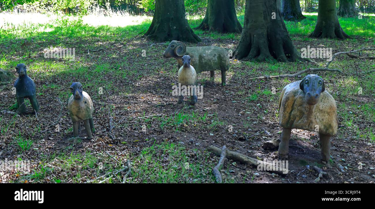 Fake sheep in a small woodland part of a pasture - sculptures in a ...