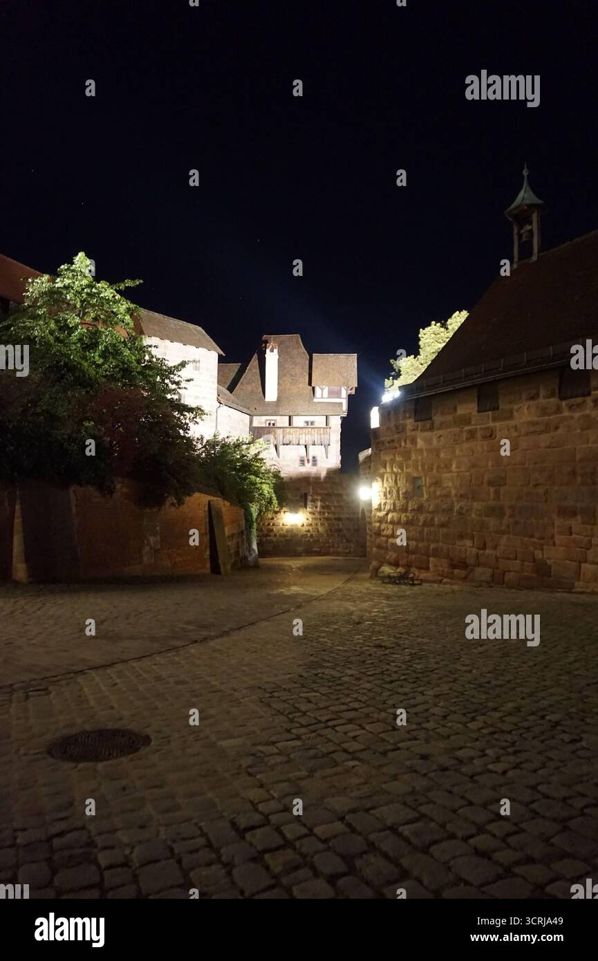 Nuremberg's medieval Castle Kaiserburg illuminated at night with ...
