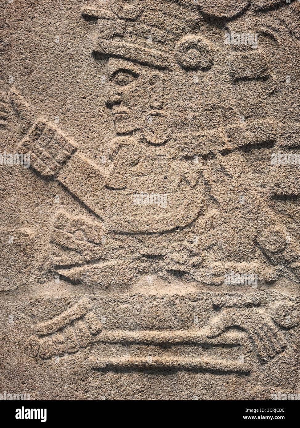 Vertical close up of an ancient South American relief plaque in a ...