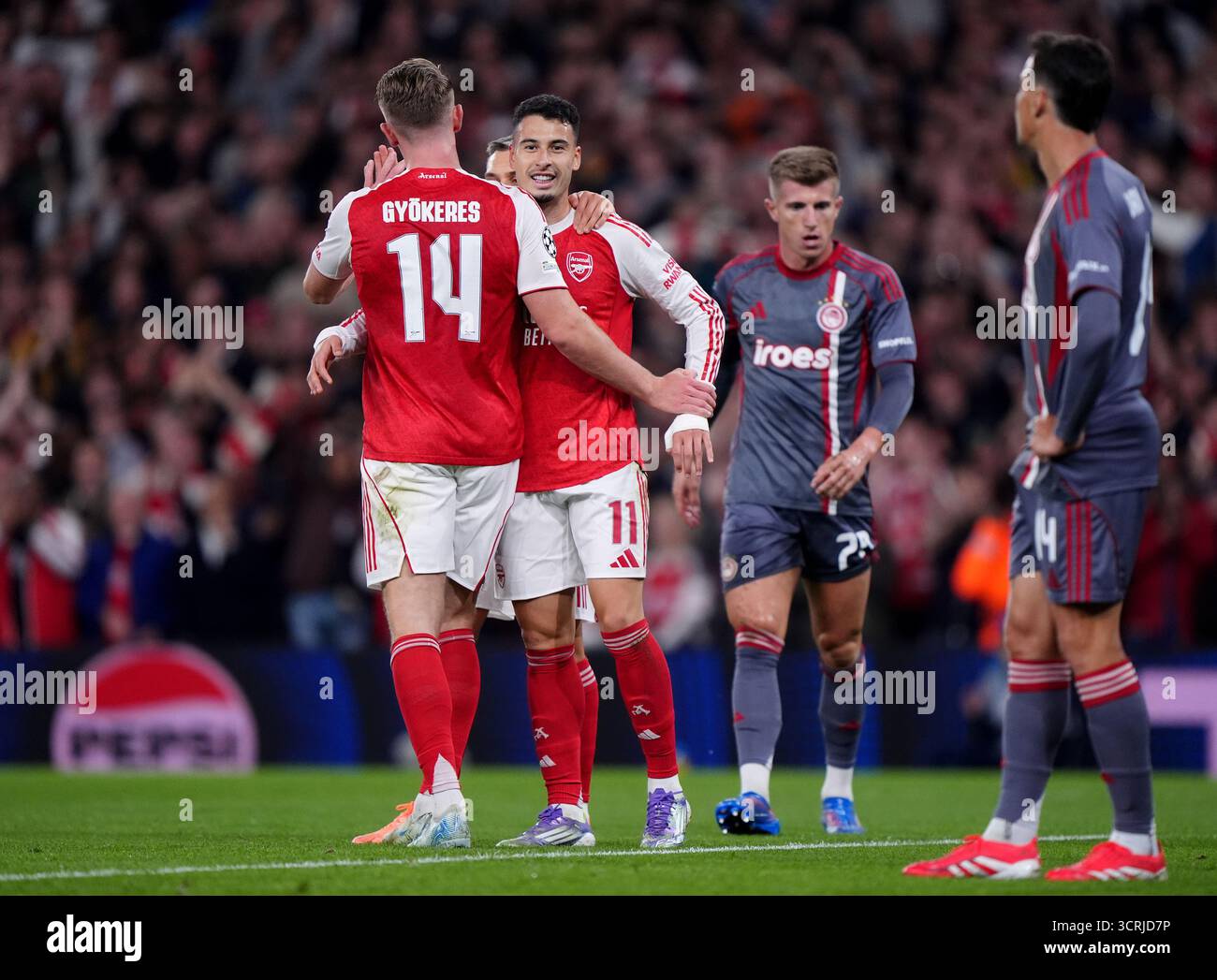 Arsenal's Gabriel Martinelli celebrates with team-mate Viktor Gyokeres ...