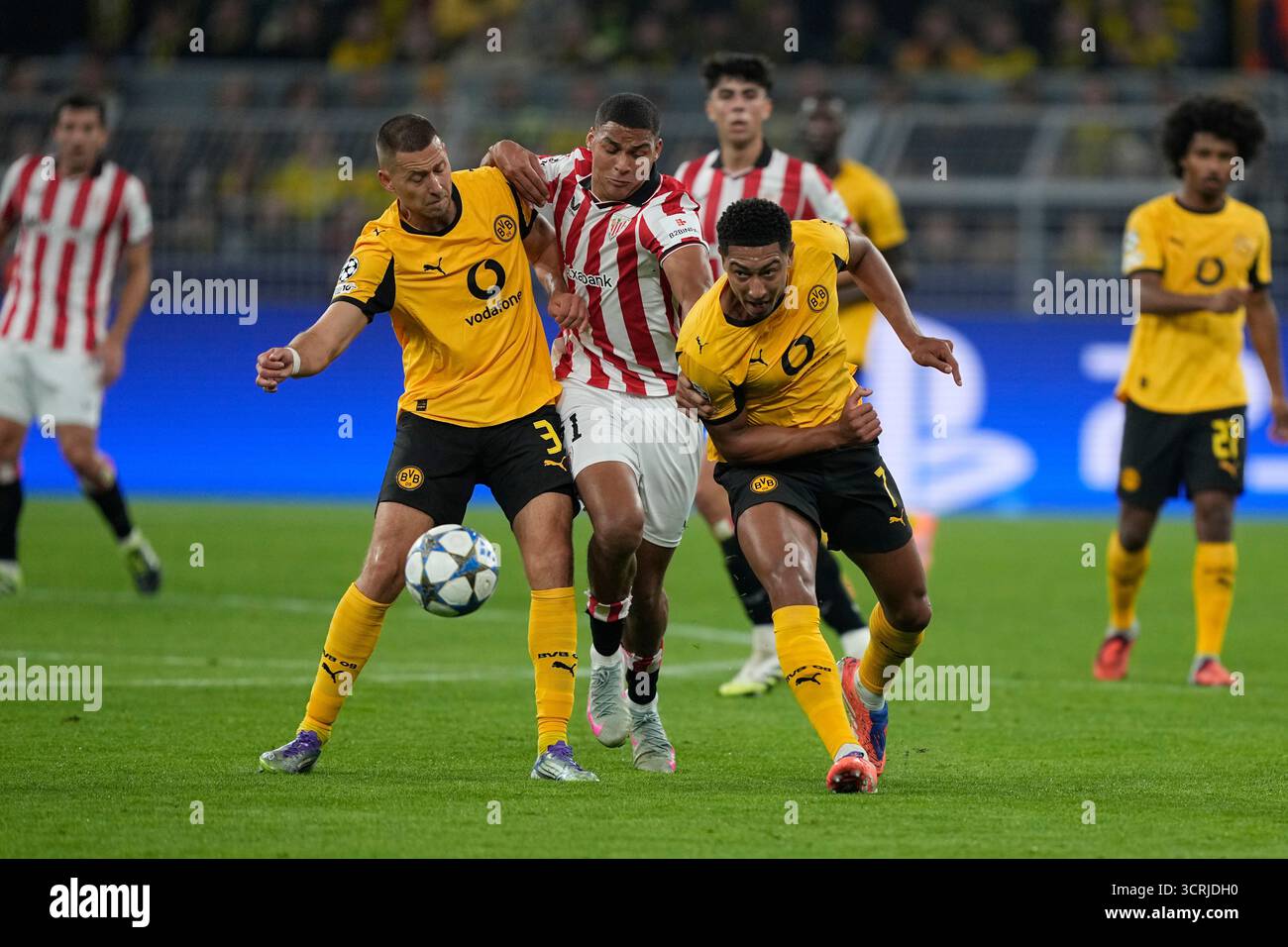 Dortmund's Waldemar Anton, centre left, and Jobe Bellingham, centre ...
