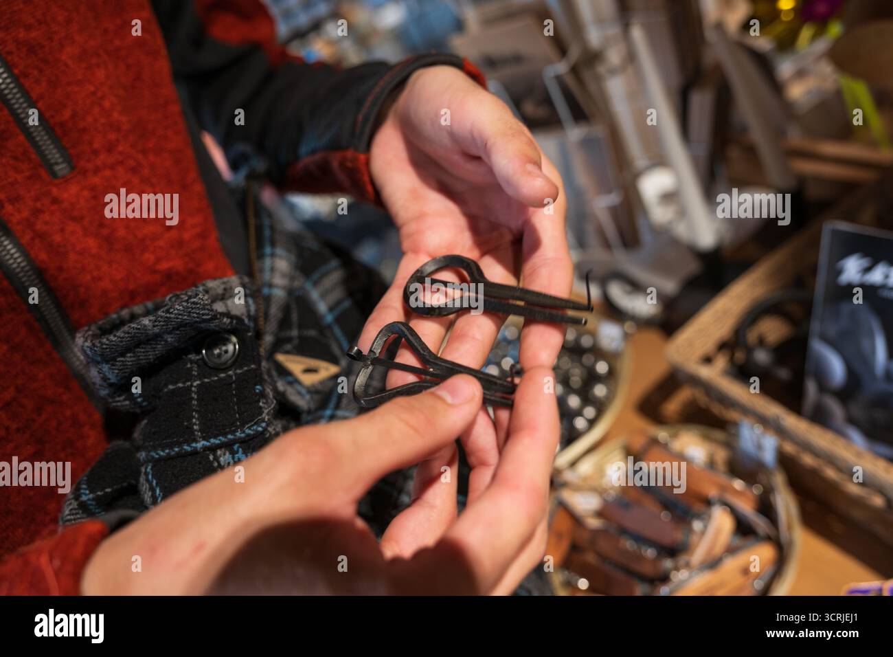 Hands holding traditional jews harp musical instruments in shop Stock ...