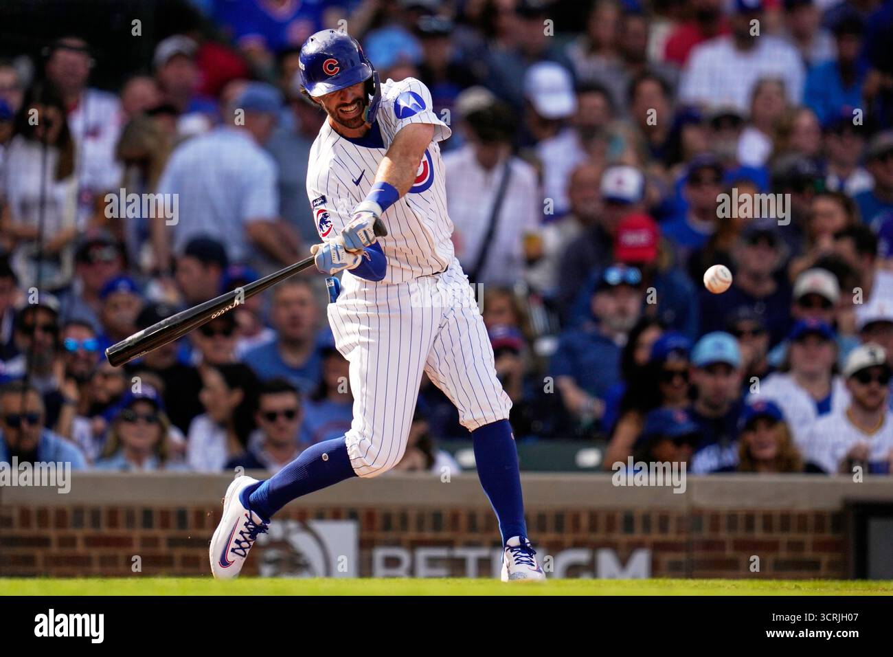 Chicago Cubs' Dansby Swanson hits a single during the third inning of ...