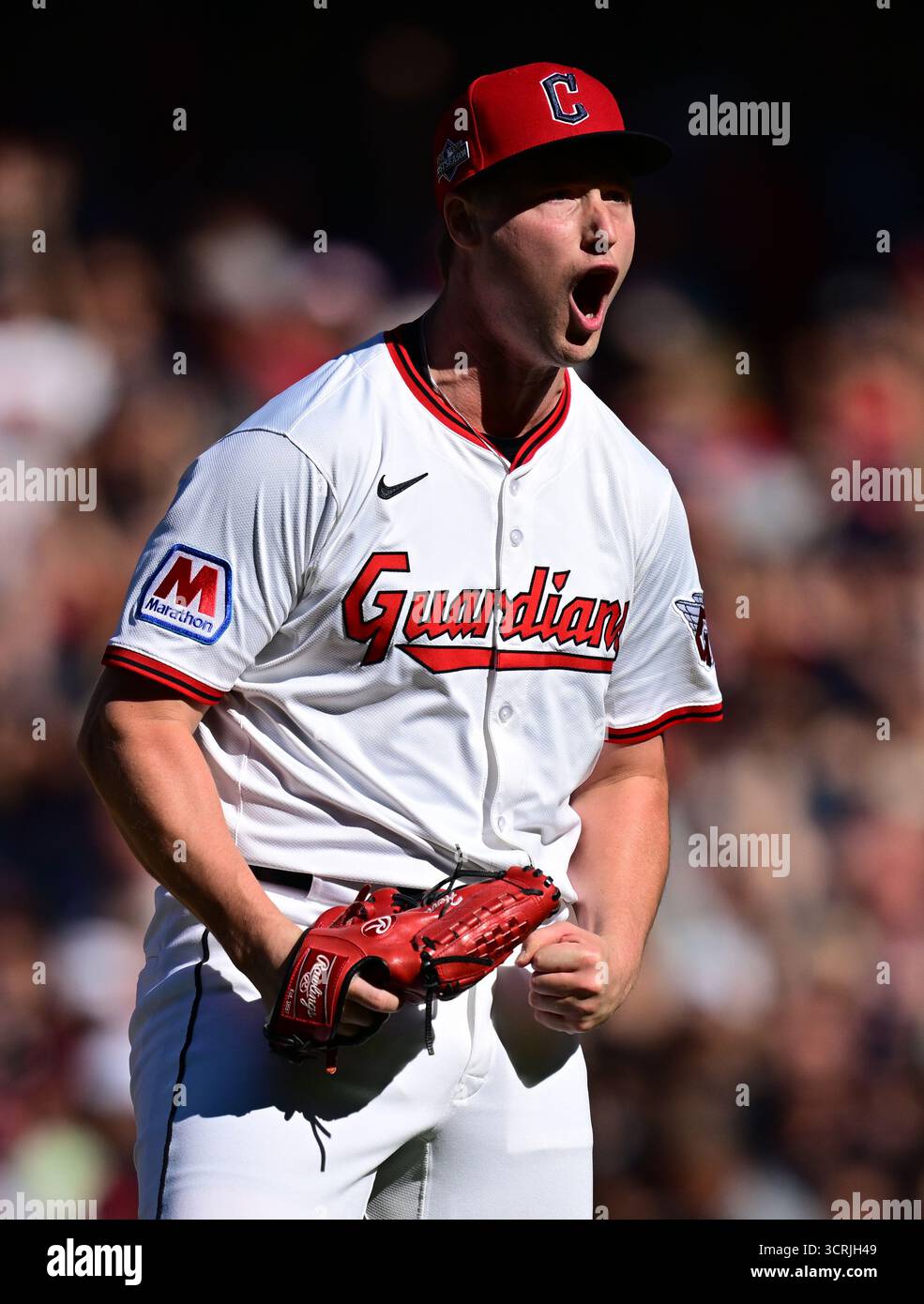 Cleveland Guardians pitcher Tim Herrin reacts after striking out ...