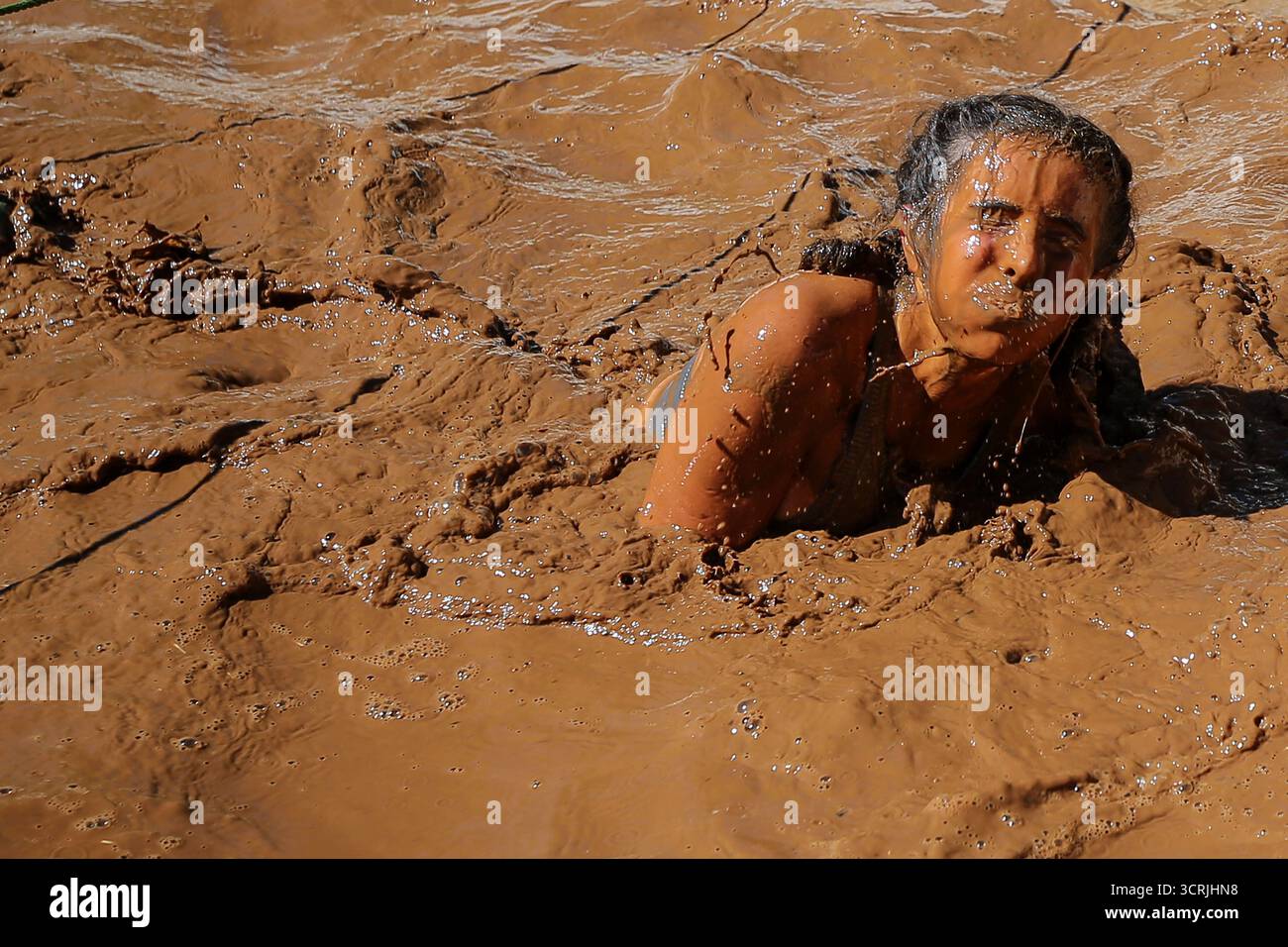 Female crawling in mud hi-res stock photography and images - Alamy