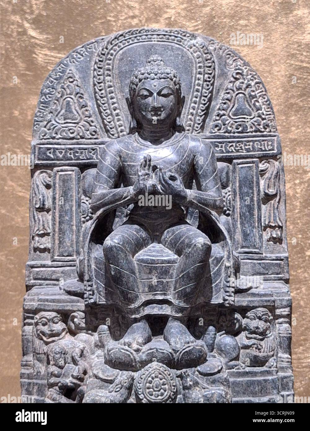 Vertical close up of an ancient Buddhist statue depicting Buddha ...