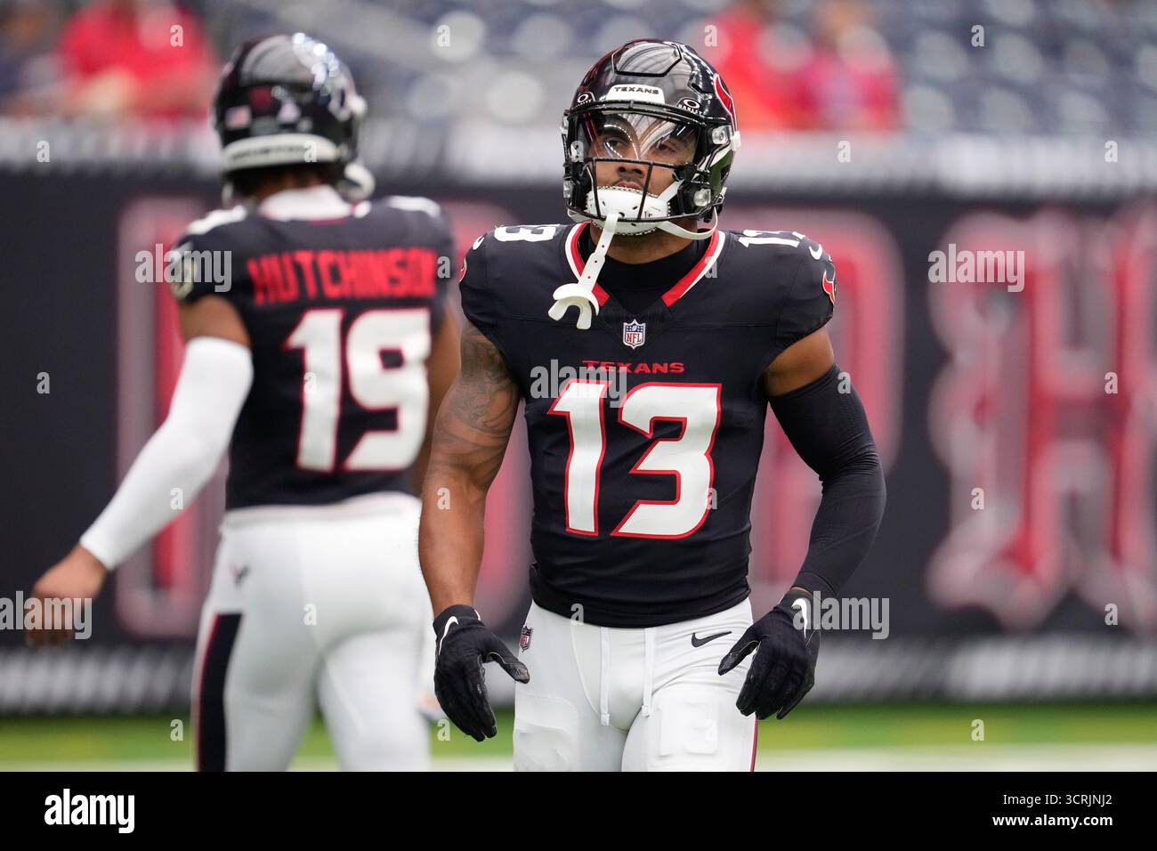 Houston Texans wide receiver Christian Kirk warms up before an NFL ...