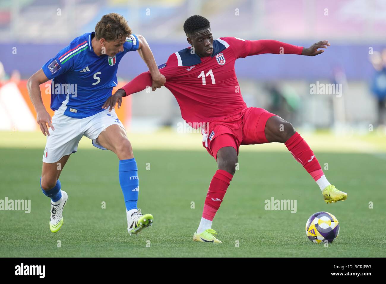 Cuba's Romario Torres (11) and Italy's Andrea Natali battle for the ...