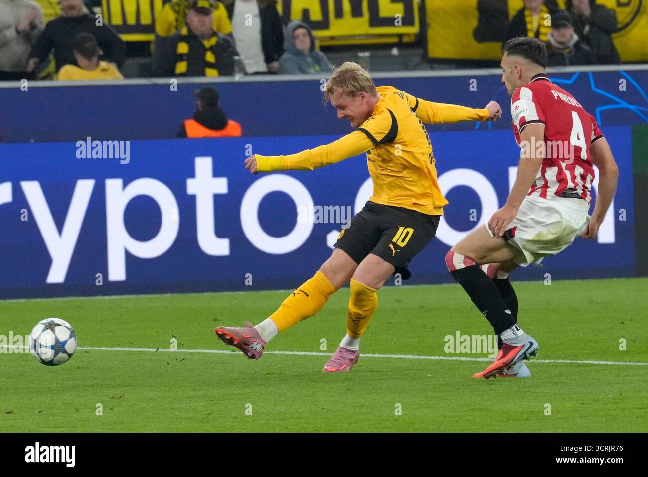 Dortmund's Julian Brandt, left, scores his side's fourth goal during ...