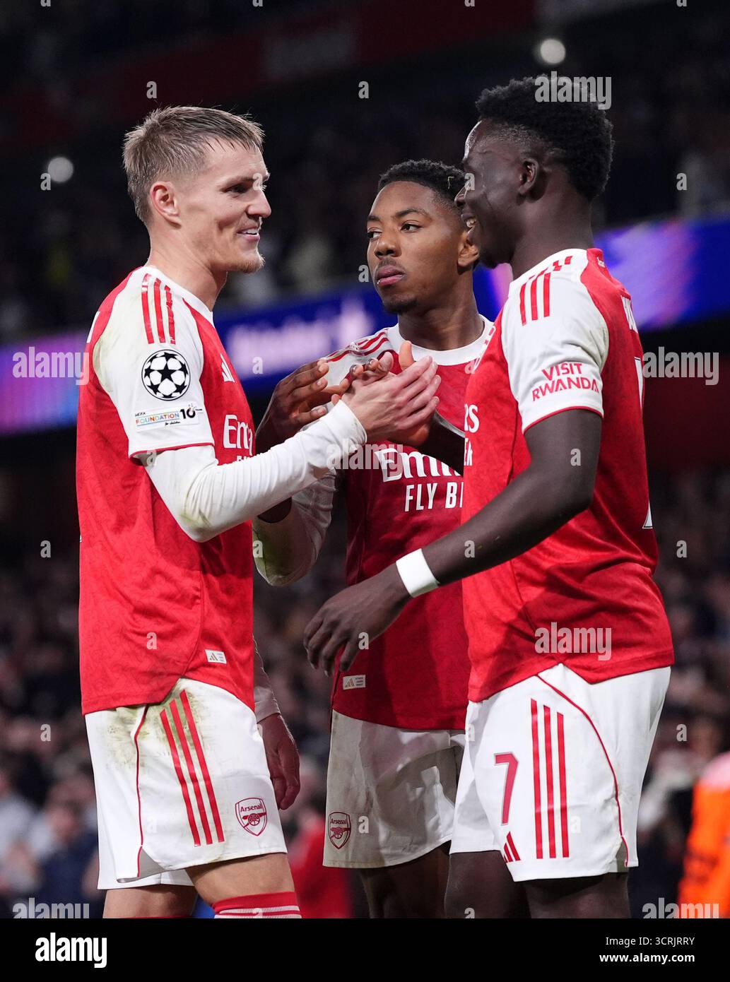 Arsenal's Bukayo Saka (right) celebrates with Martin Odegaard (left ...