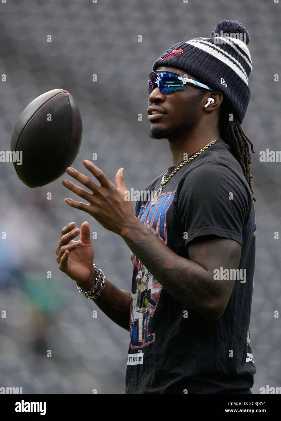 Houston Texans safety Calen Bullock warms up before an NFL football ...