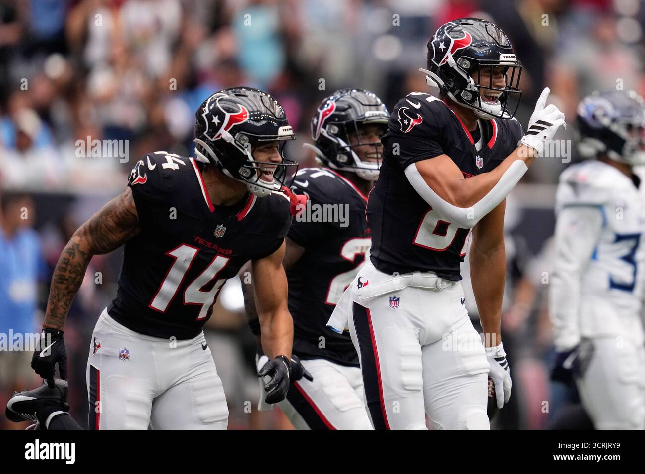 Houston Texans wide receiver Jayden Higgins, right, celebrates after a ...