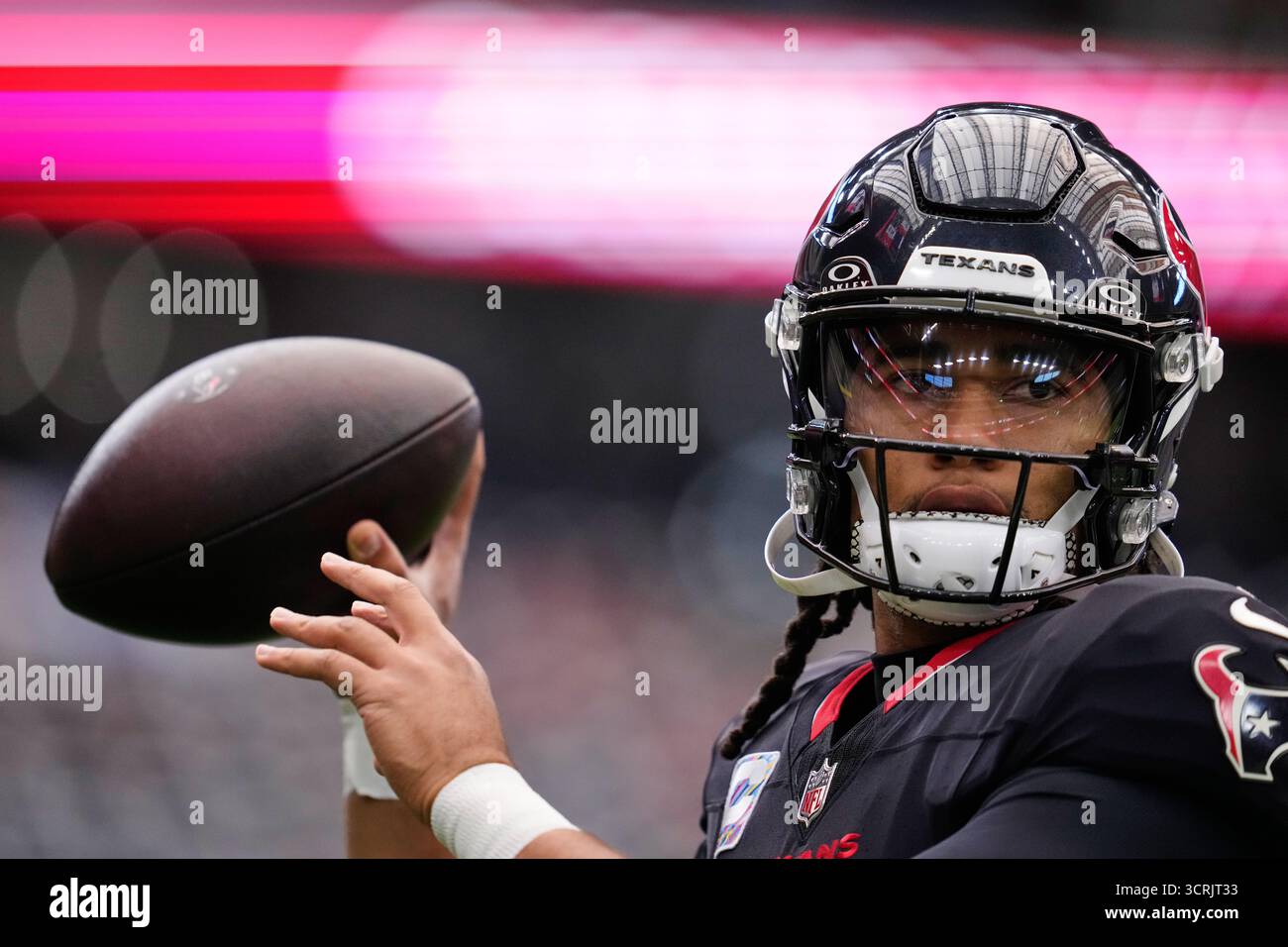 Houston Texans quarterback C.J. Stroud warms up before an NFL football ...