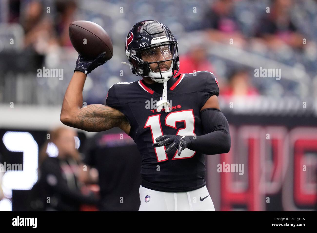 Houston Texans wide receiver Christian Kirk warms up before an NFL ...