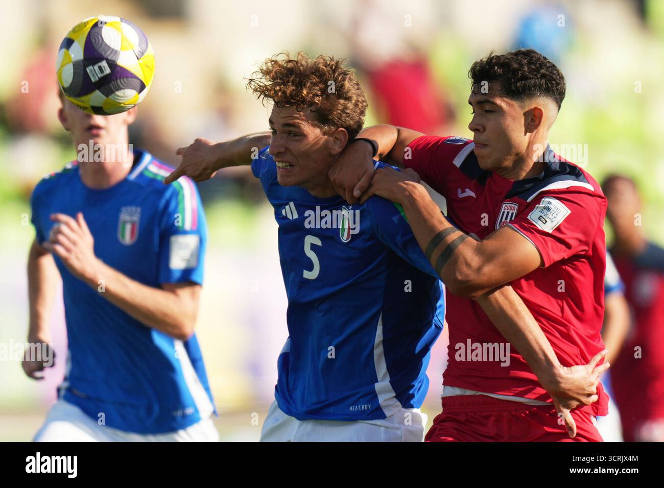 Italy's Andrea Natali (5) and Cuba's Alessio Raballo battle for the ...