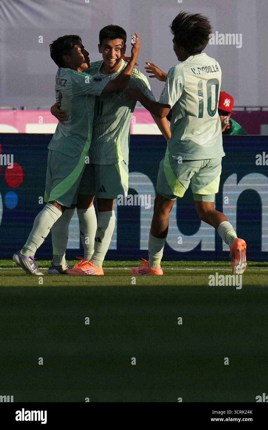 Mexico's Gilberto Mora, center, celebrates scoring his side's second ...