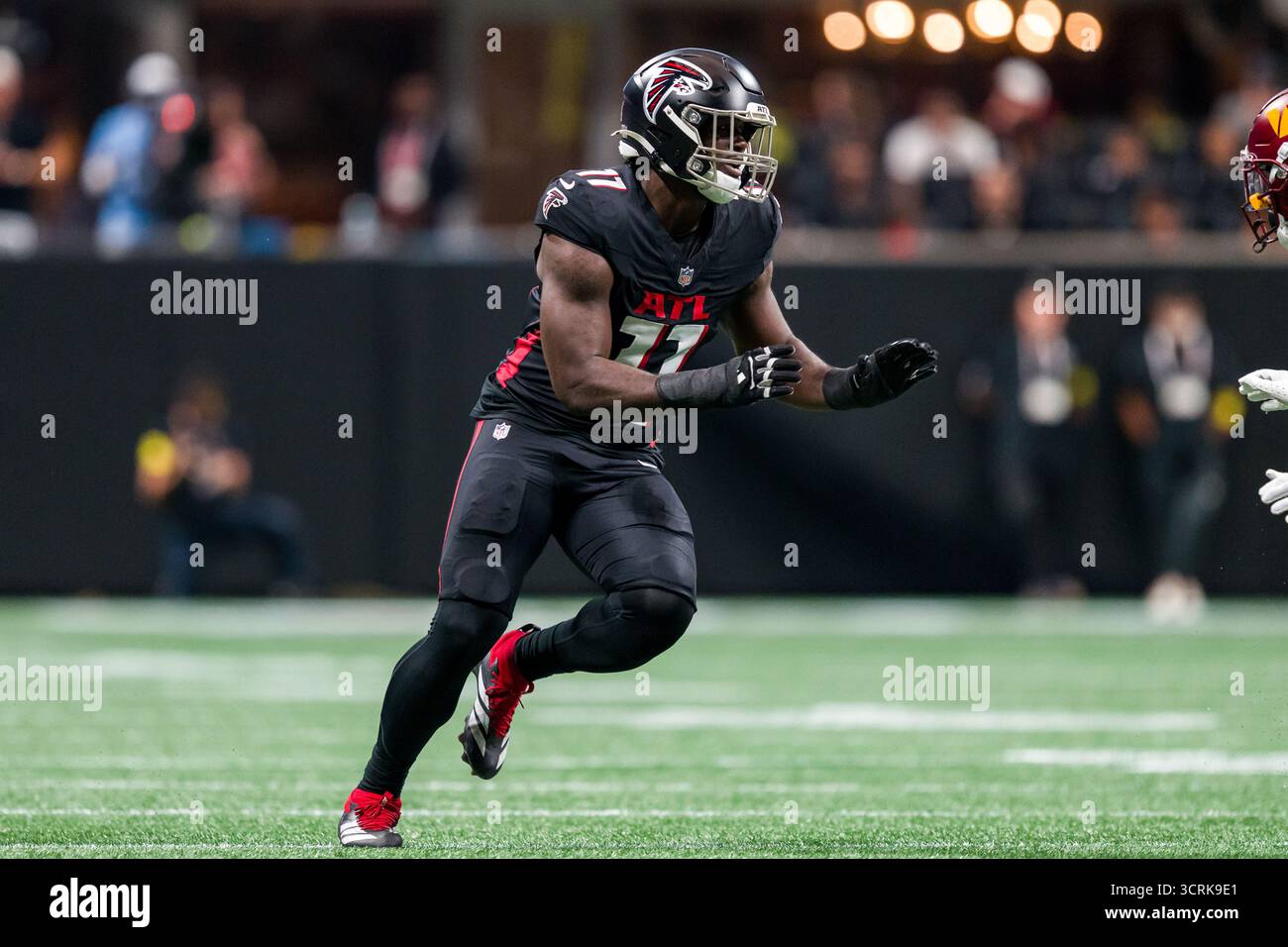 Atlanta Falcons defensive end Jalon Walker (11) works during the first ...