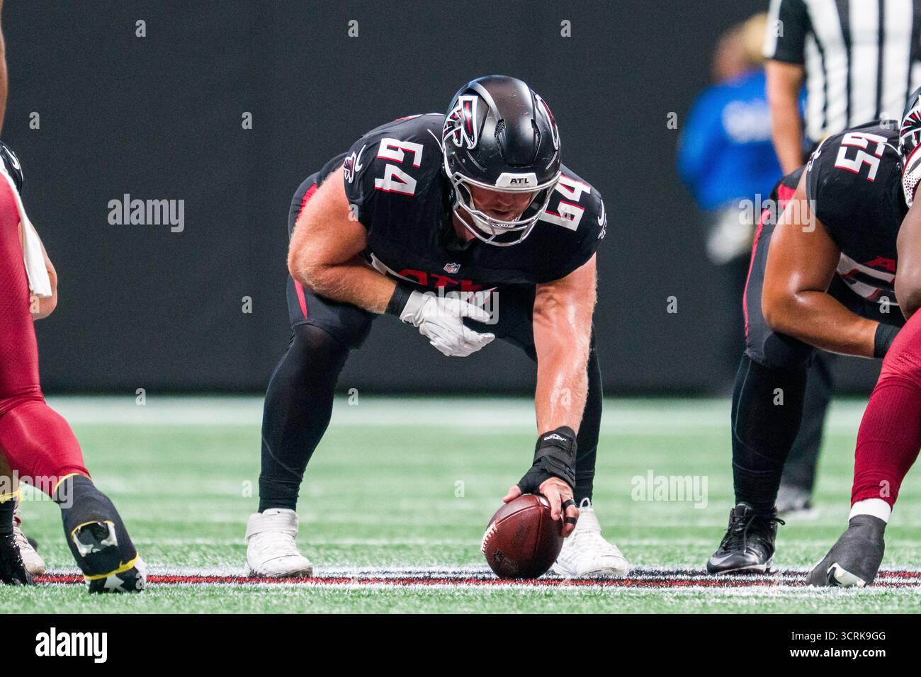 Atlanta Falcons center Ryan Neuzil (64) lines up during the first half ...