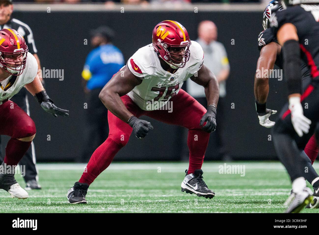 Washington Commanders guard Chris Paul (75) works during the first half ...