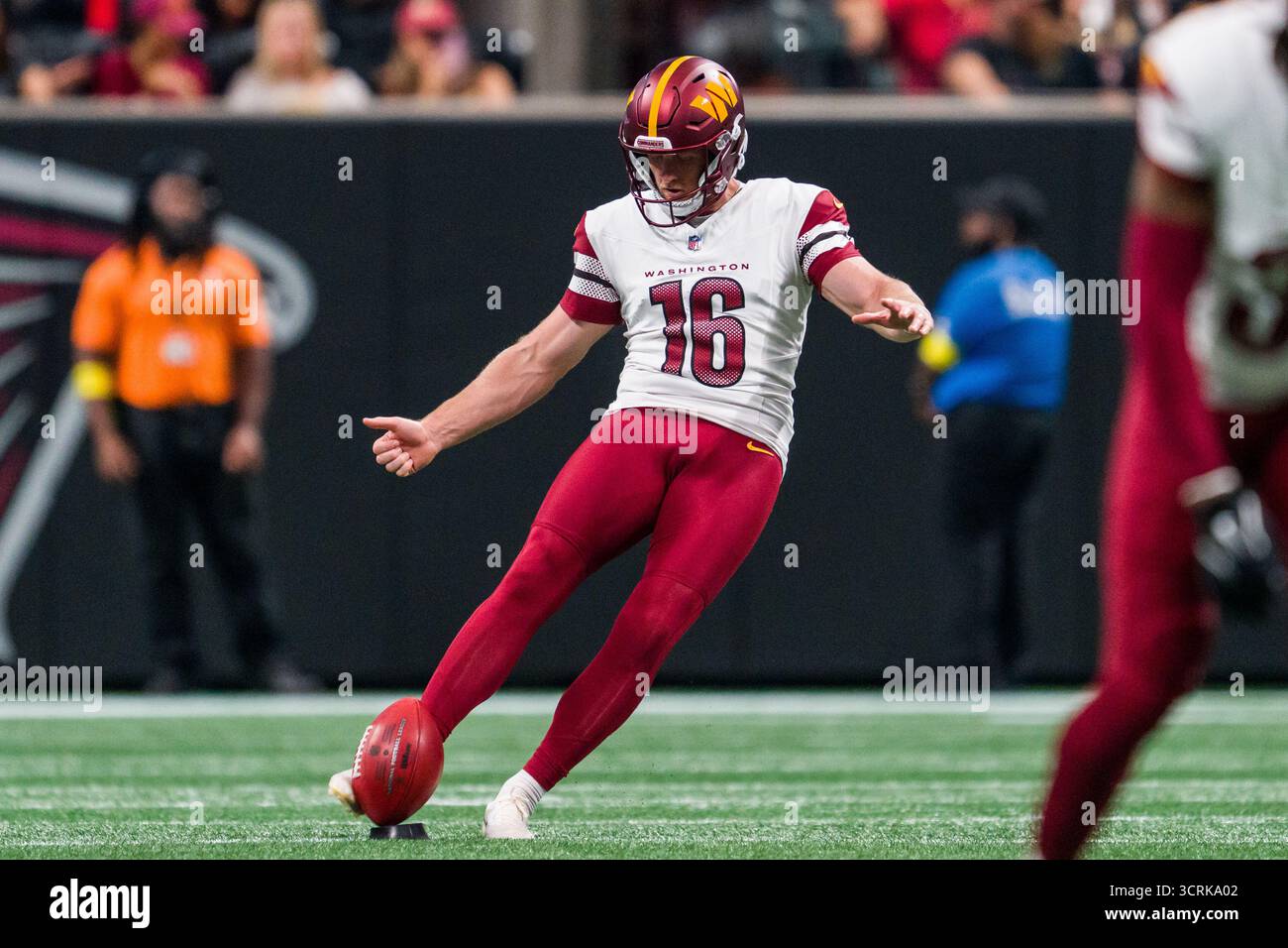 Washington Commanders kicker Matt Gay (16) kicks off during the first ...