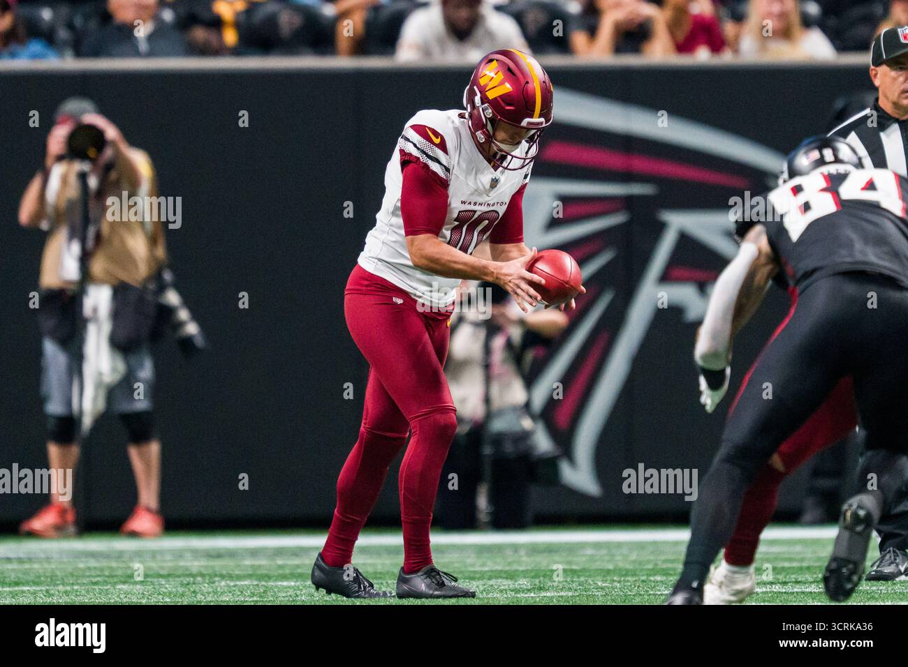 Washington Commanders punter Tress Way (10) punts during the first half ...