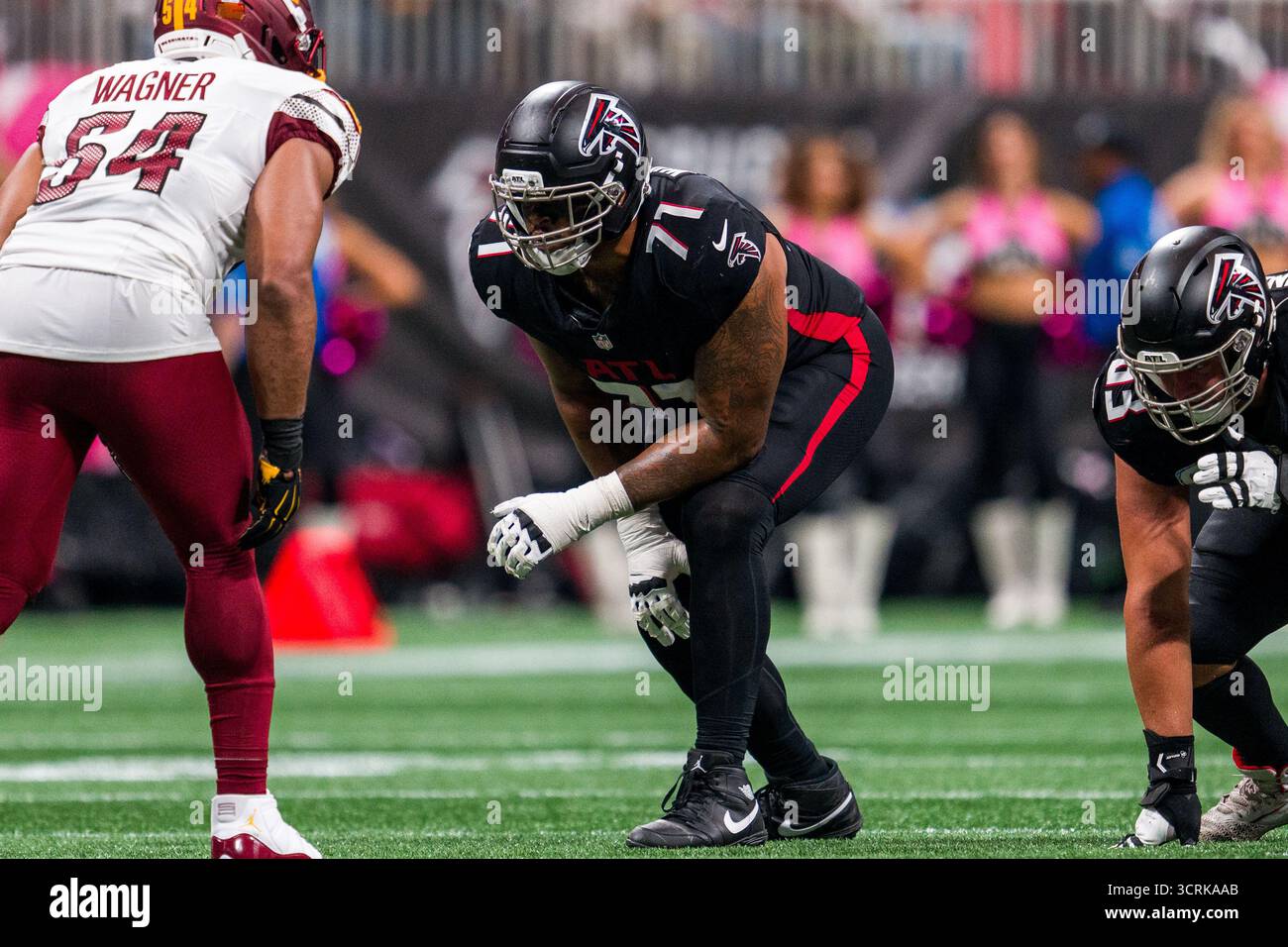 Atlanta Falcons offensive tackle Elijah Wilkinson (71) lines up during ...
