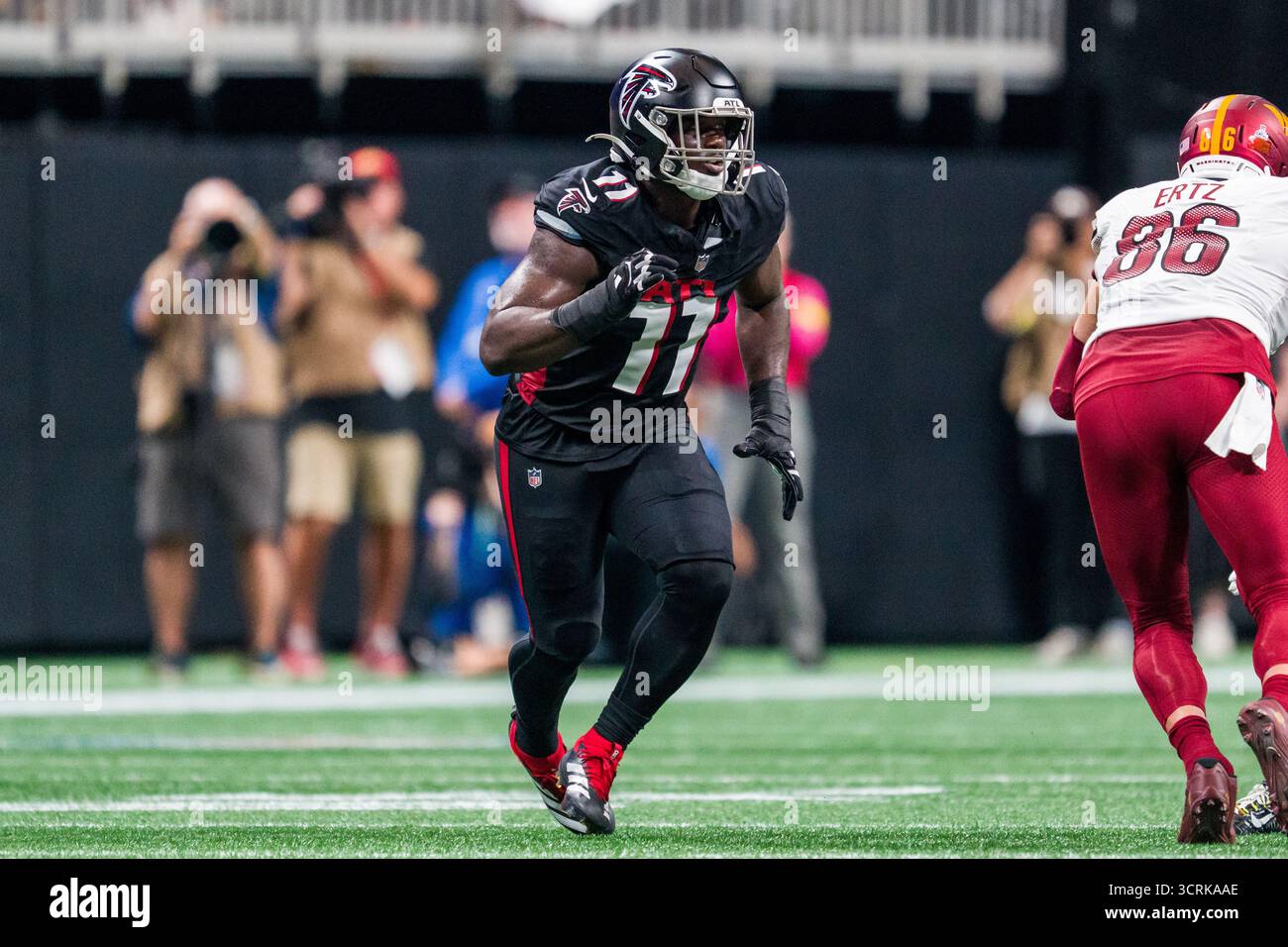 Atlanta Falcons defensive end Jalon Walker (11) works during the second ...