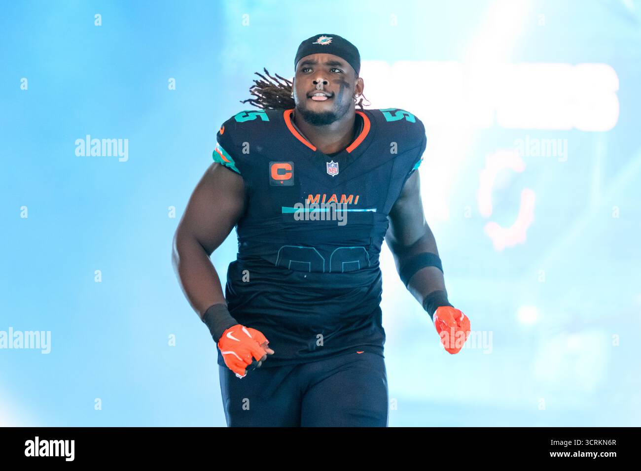 Miami Dolphins offensive lineman Aaron Brewer (55) runs onto the field ...