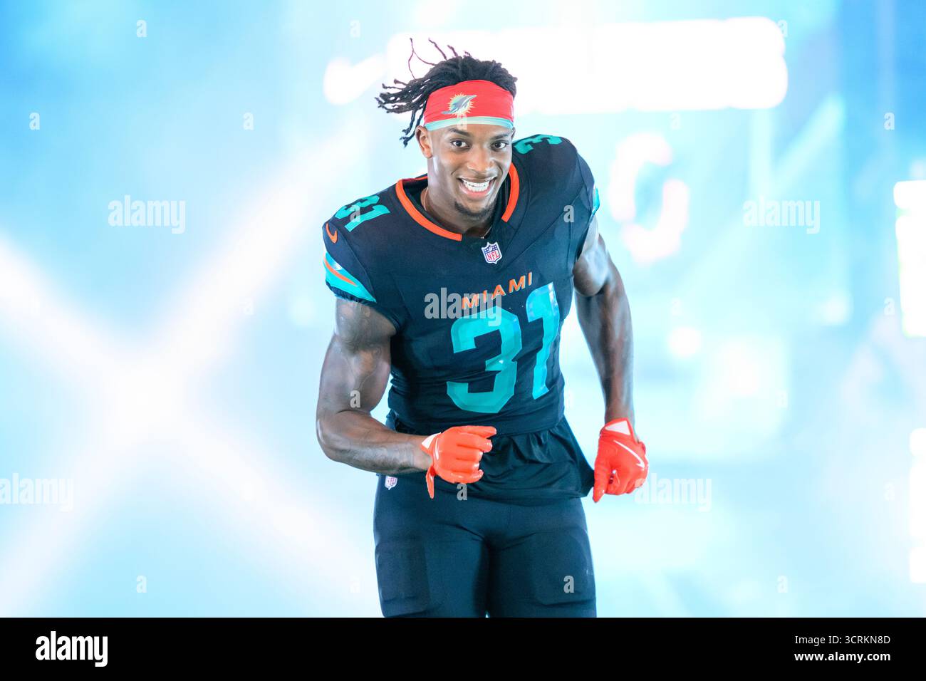 Miami Dolphins running back Ollie Gordon II (31) smiles as he runs onto ...