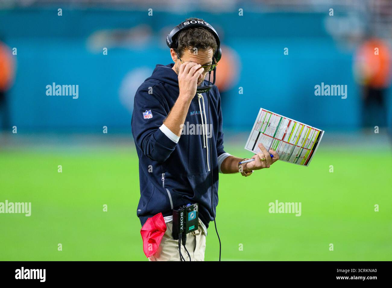 Miami Dolphins head coach Mike McDaniel looks down on the sidelines ...