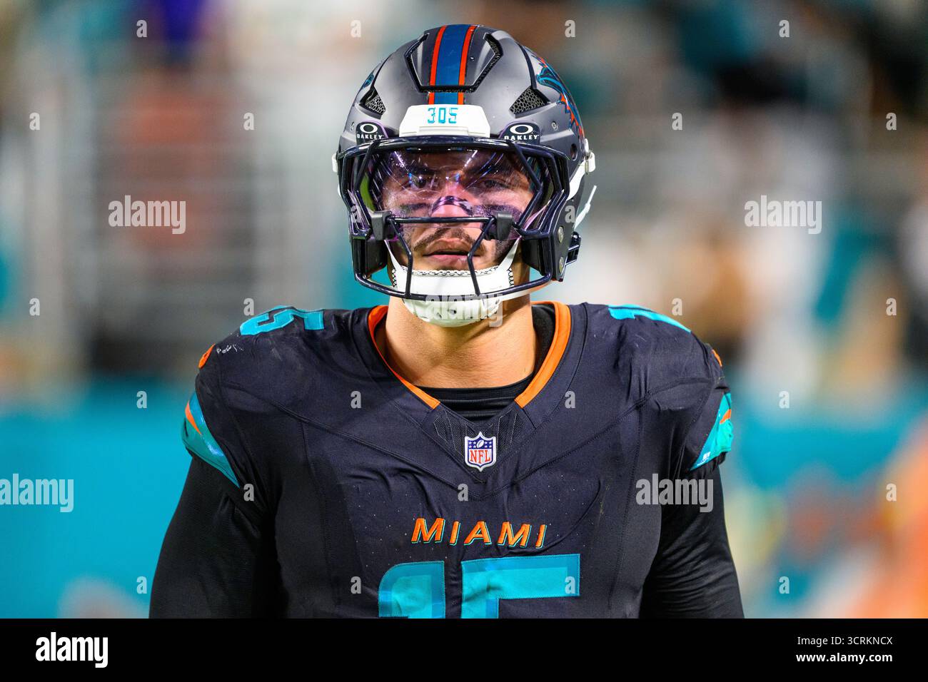 Miami Dolphins linebacker Jaelan Phillips (15) walks back to the ...