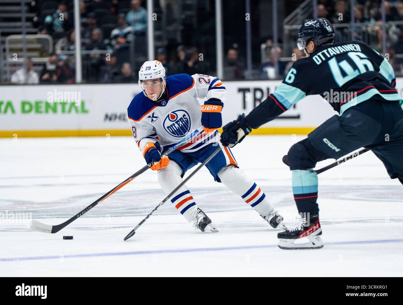 Edmonton Oilers forward Quinn Hutson (28), left, skates against Seattle ...