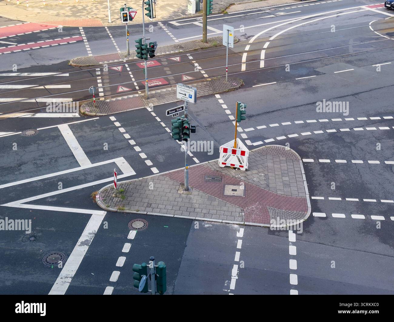 Aerial view of a busy urban intersection featuring crosswalks, traffic ...