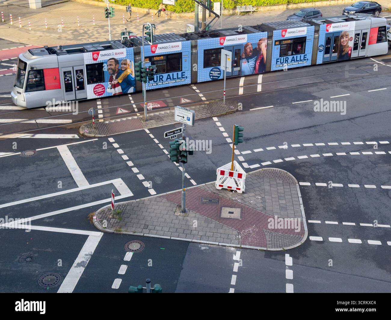Aerial view of a busy urban intersection featuring crosswalks, traffic ...