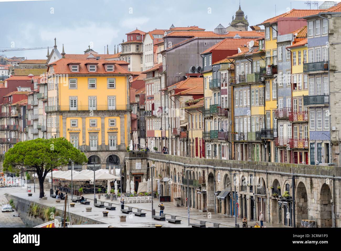 Colorful historic houses with terracotta roofs and the arcaded ...