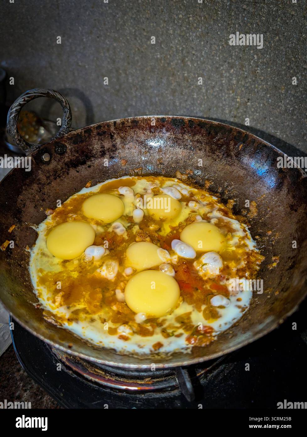 Process frying eggs in pan hi-res stock photography and images - Alamy
