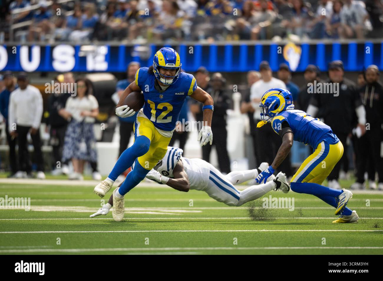 Los Angeles Rams wide receiver Puka Nacua (12) runs with the ball ...