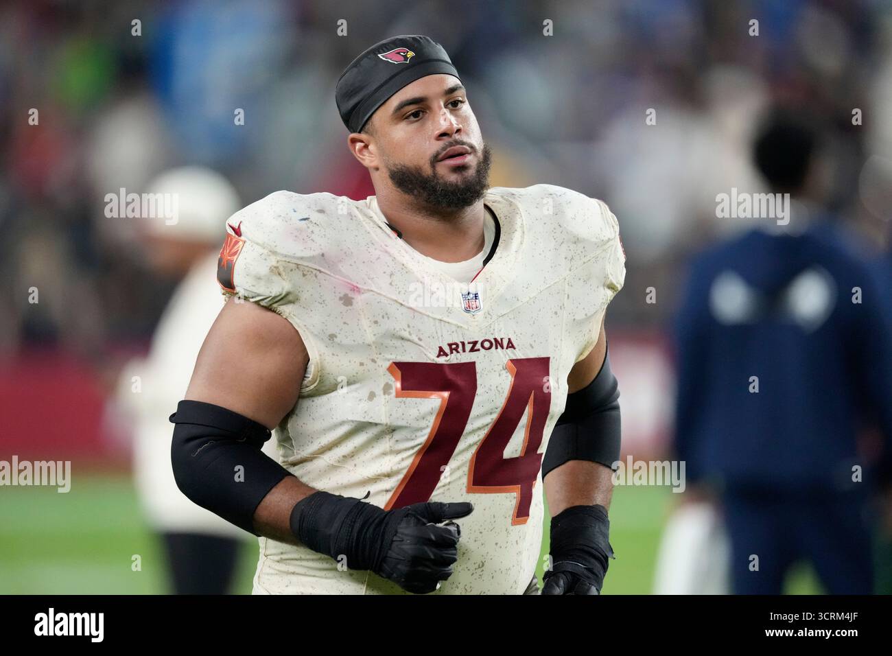 Arizona Cardinals guard Isaiah Adams walks off the field after an NFL ...