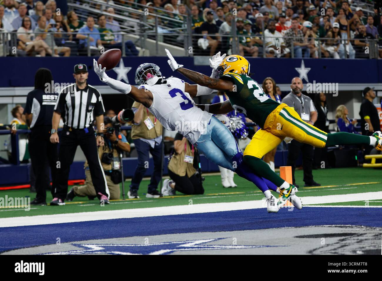 Dallas Cowboys wide receiver George Pickens (3) stretches as he reaches ...
