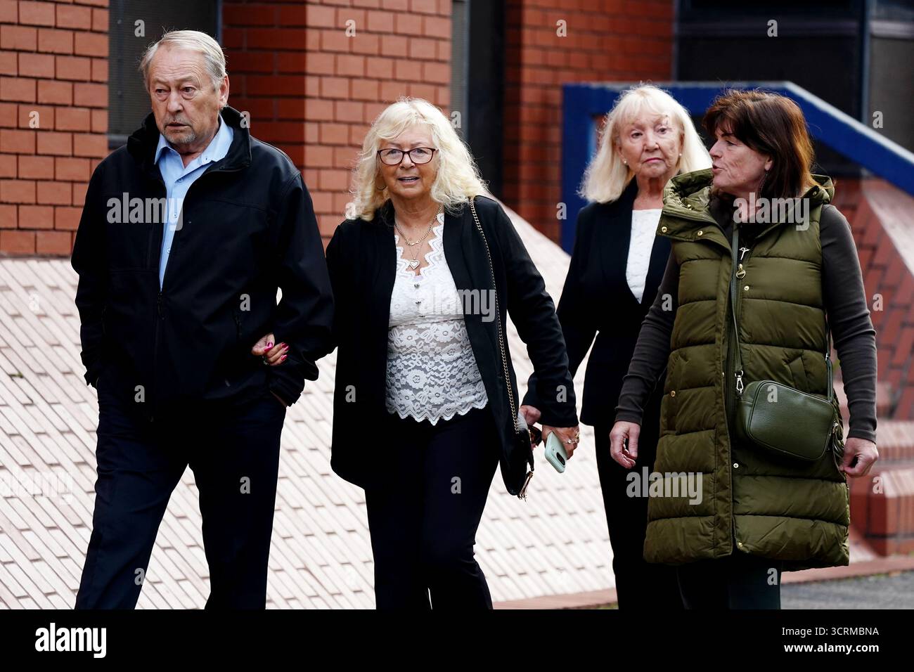 Karen Spragg (second left) arrives at Leicester Crown Court, where she ...