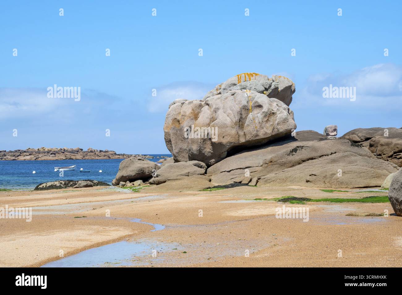 Spectacular pink granite rocks, sculpted by wind and sea, pile up on ...