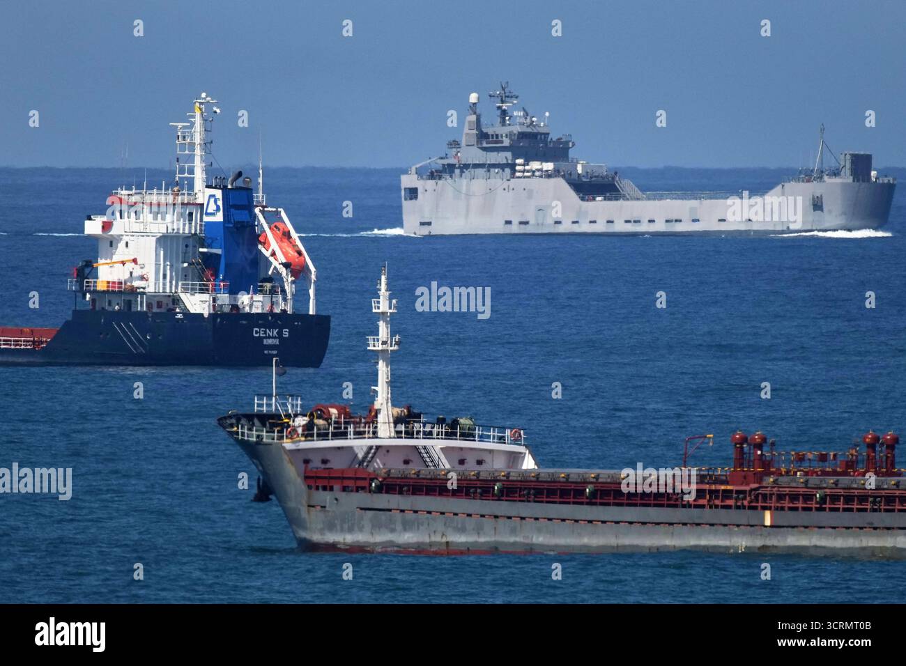 An Israeli Navy vessel, rear right, moves in the Mediterranean sea ...