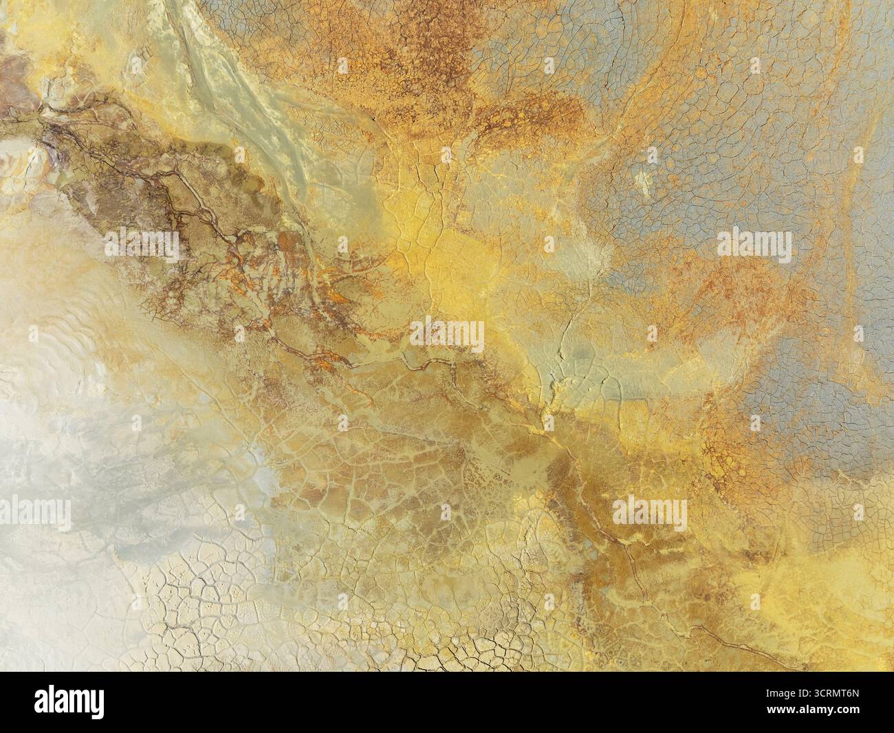 Aerial view of swirling, ochre-stained earth reveals the dramatic ...